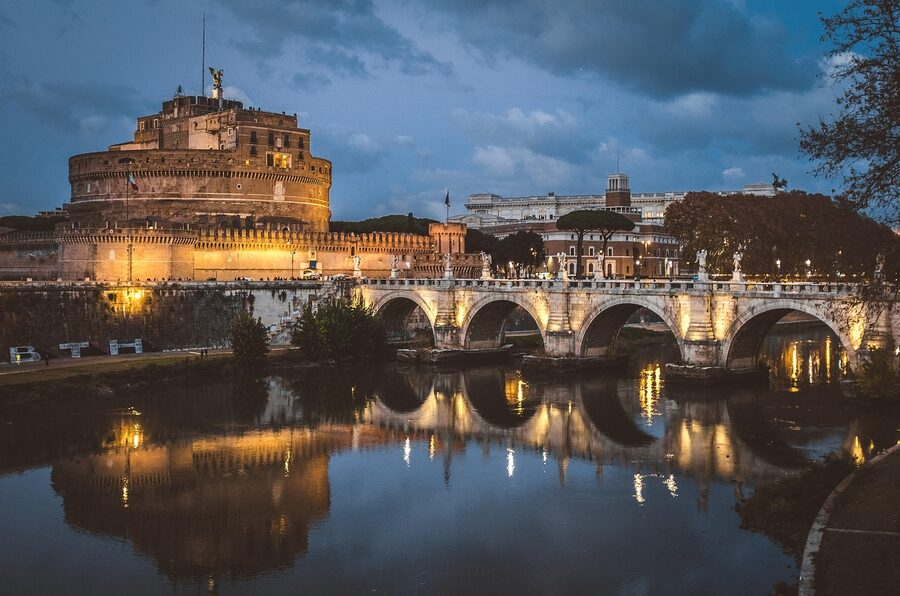Castel Sant'Angelo lit up at blue hour over the Tiber Rome