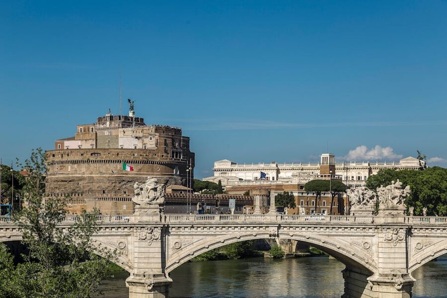 View of Castel Sant'Angelo and Ponte Sant'Angelo from across the Tiber River in Rome