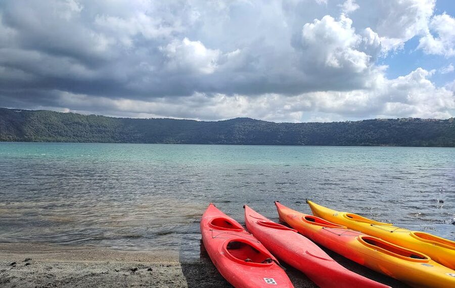 Kayaks on the shore of Lake Albano under Castel Gandolfo