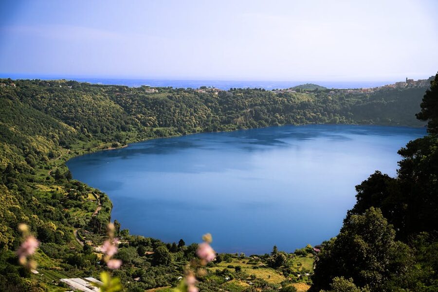 Panoramic view of Lake Nemi surrounded by green hills in Lazio Italy