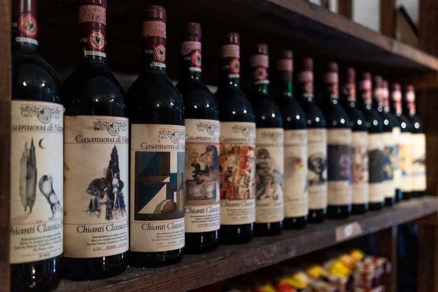Chianti Classico wine bottles arranged on a cellar shelf