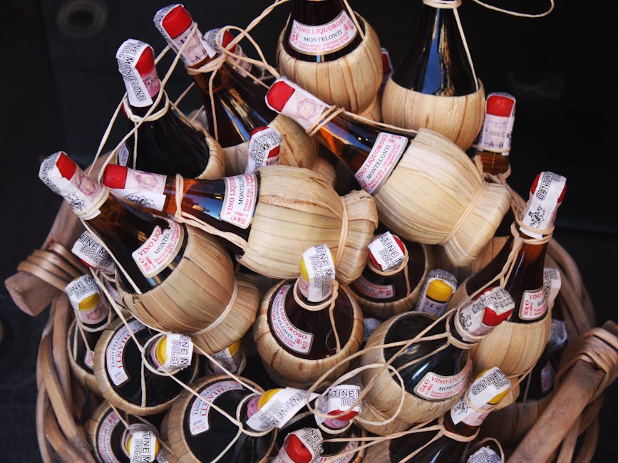 Traditional Chianti wine bottles in straw fiasco baskets
