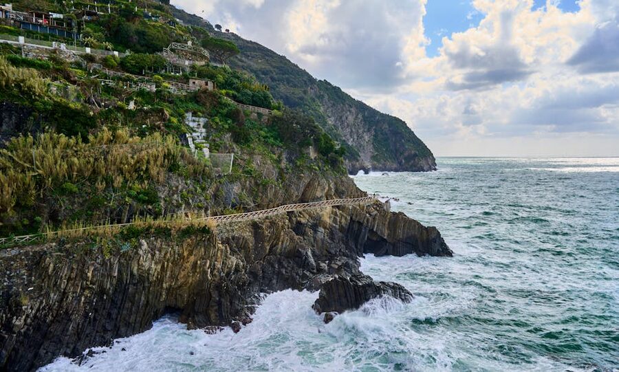 Rocky Cinque Terre coastline with the coastal hiking trail in the foreground