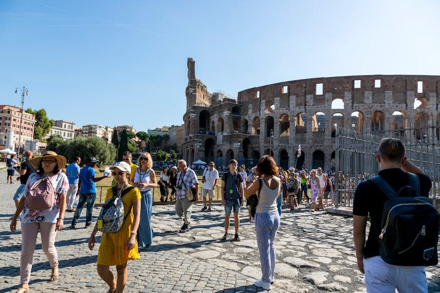 Tourists exploring the Colosseum on a guided tour Rome