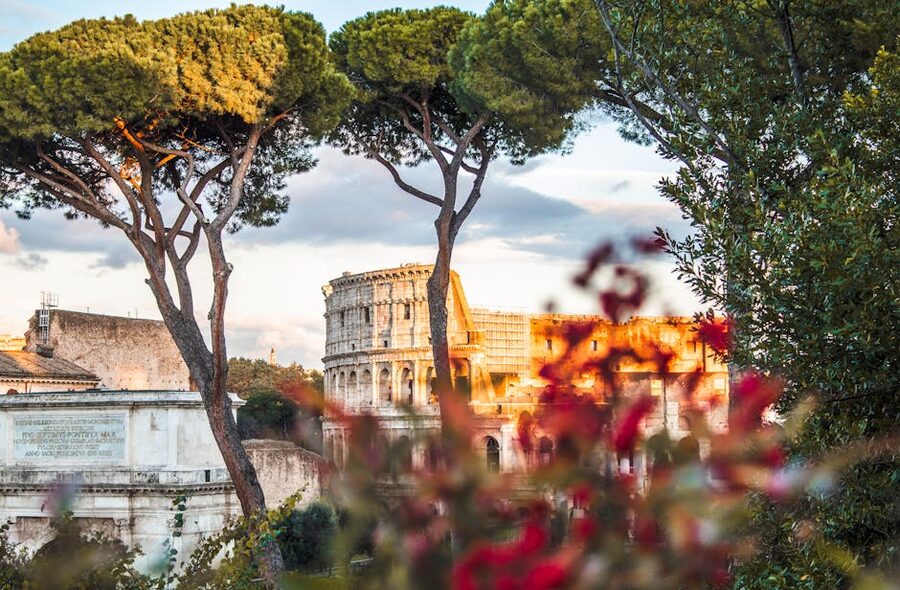 Colosseum framed by trees and flowers in spring, Rome