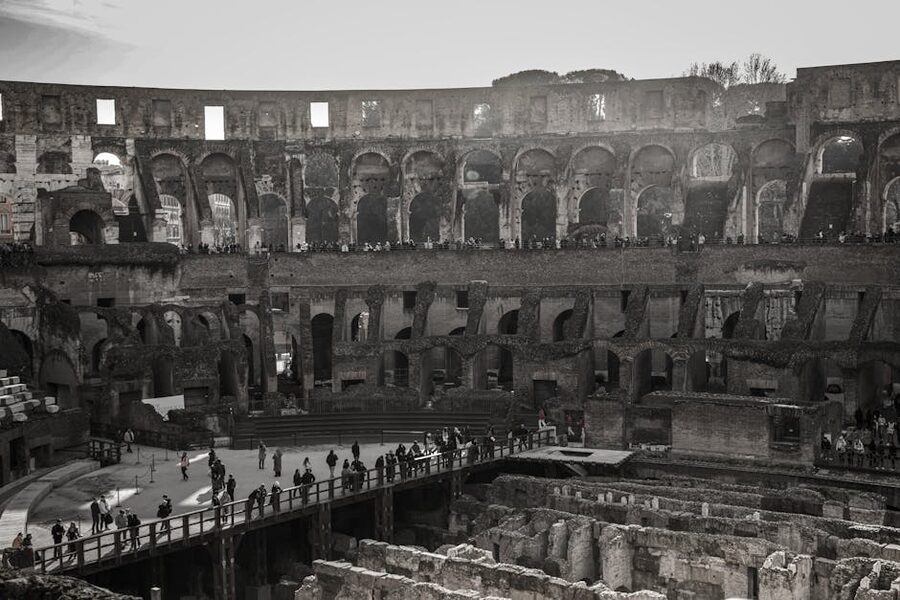 Visitors walking through the Colosseum interior