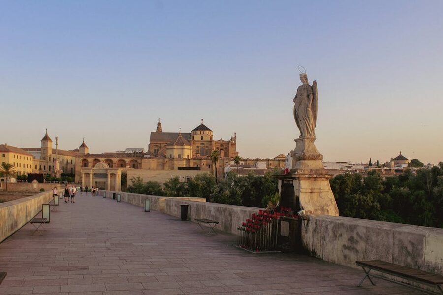 Sunset over the Roman Bridge in Cordoba with the Mezquita behind