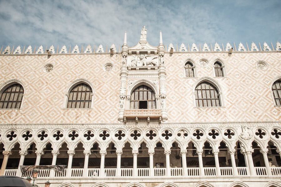 White stone facade of the Doge's Palace in Venice from below