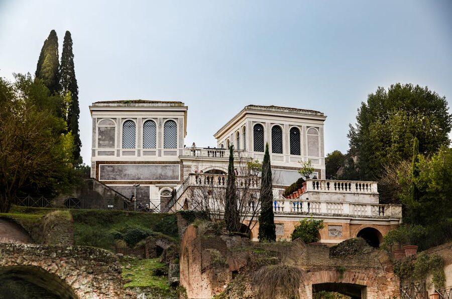 Roman ruins surrounded by lush greenery in Rome