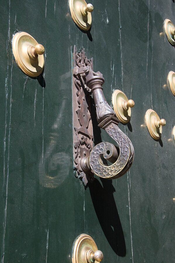 Bronze door knocker on the main portal of El Escorial Monastery