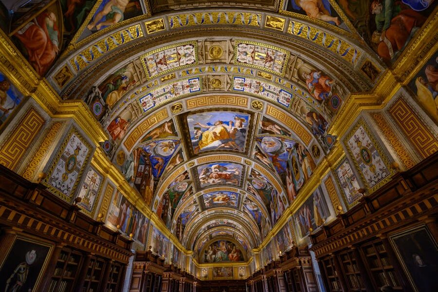 Ornate ceiling fresco of El Escorial library