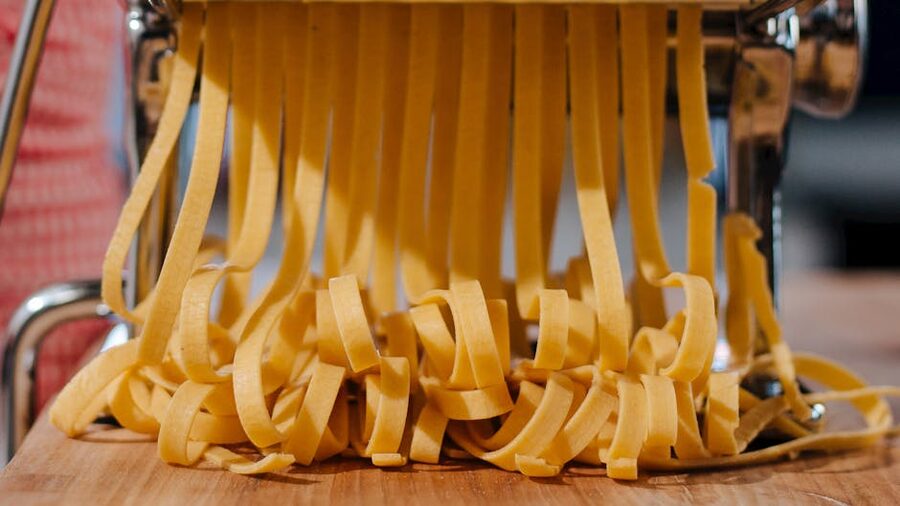 Fresh pasta strands from a pasta machine