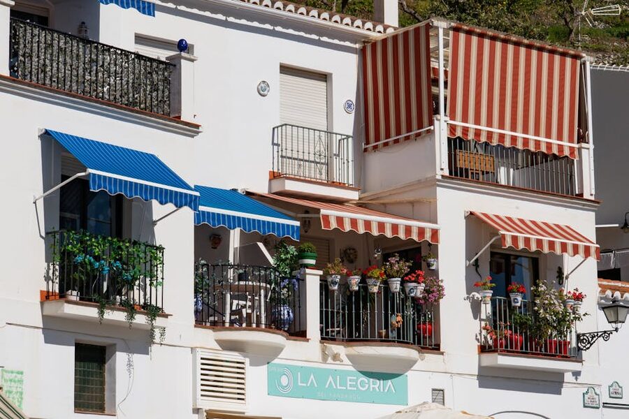 Whitewashed houses with colourful awnings in Frigiliana