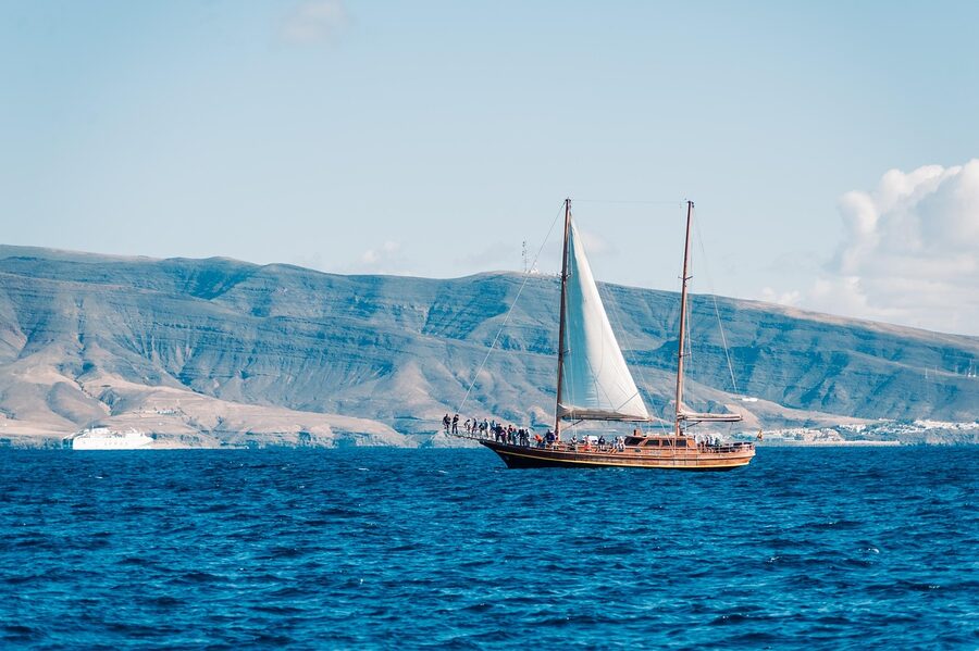 Boat off the Fuerteventura coast with mountains in the background