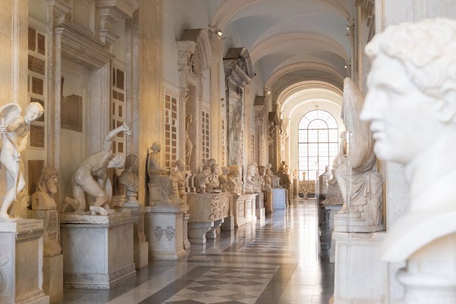 Hallway lined with classical sculptures and busts inside the Galleria Borghese