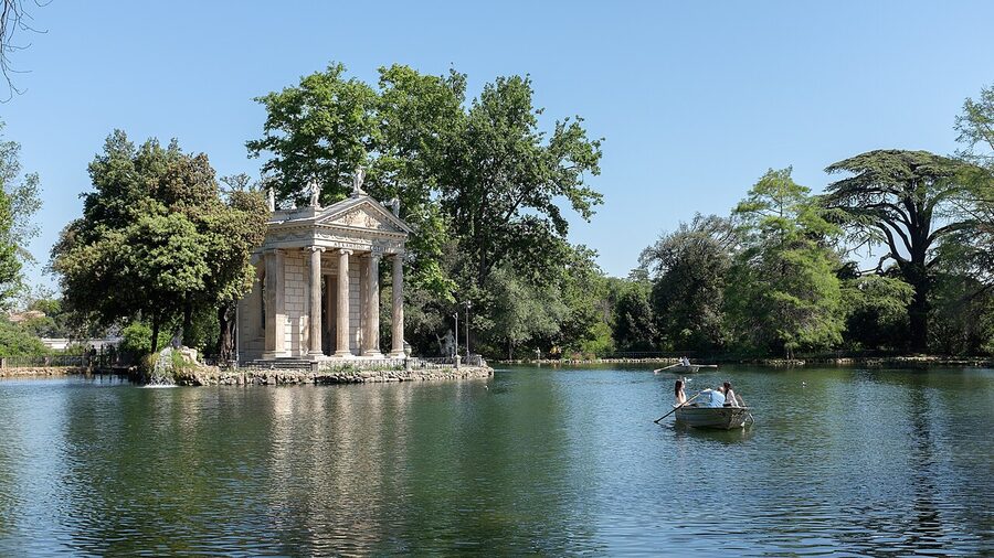 A path through the trees inside Villa Borghese park in Rome