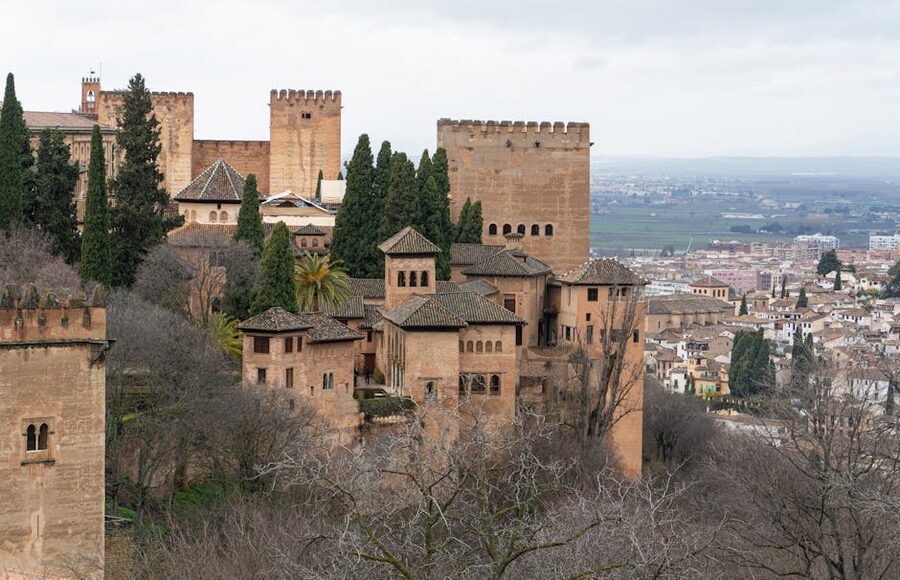 Alhambra fortress complex from a distance with Granada below