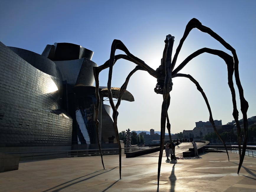 Guggenheim Bilbao with Maman spider sculpture silhouette
