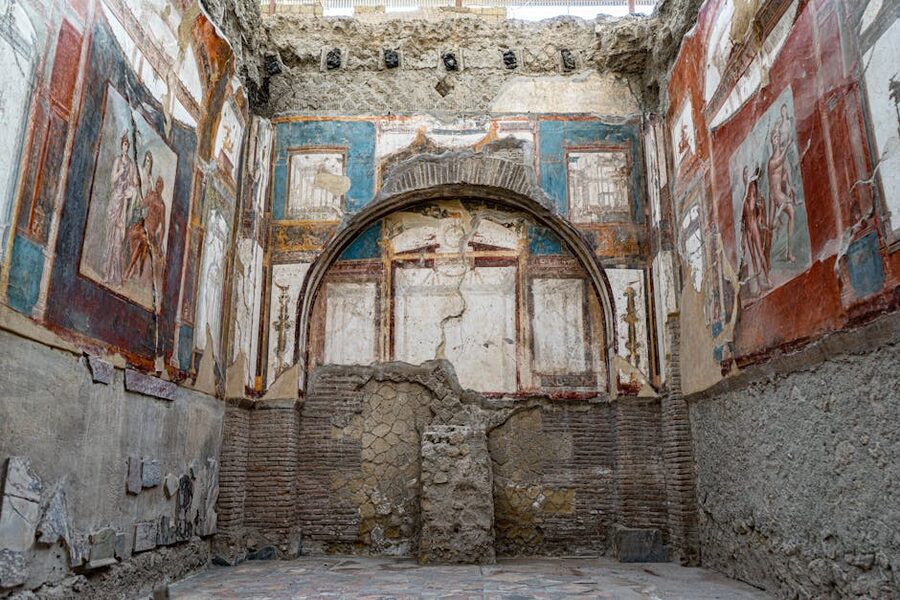 Vivid frescoes on the walls of ancient ruins at Herculaneum
