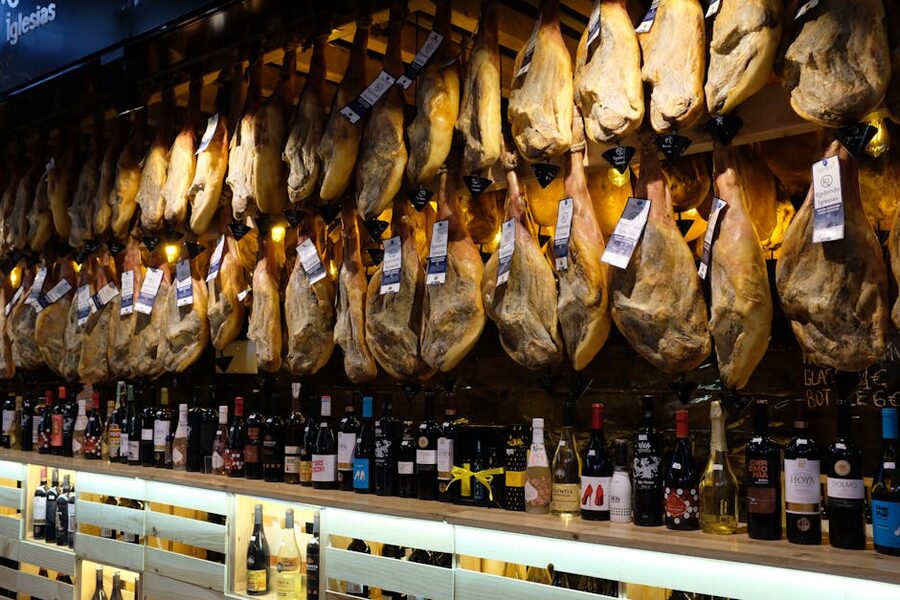 Hanging Spanish jamón at a Barcelona market