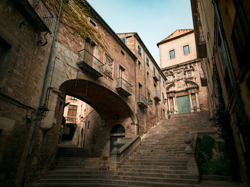 Stone stairway between medieval buildings in Girona old town
