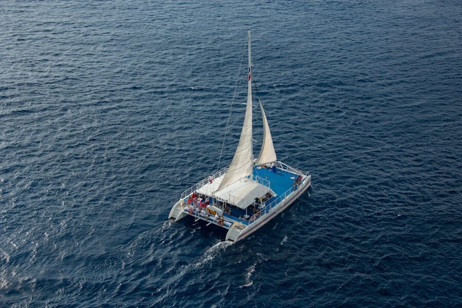 Catamaran with passengers on open sea