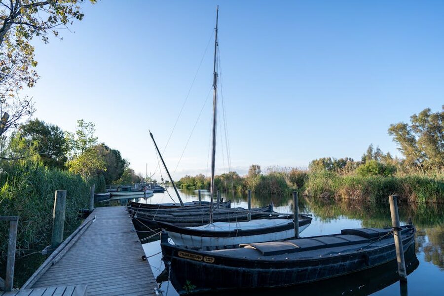 Traditional wooden boats moored at Catarroja pier Valencia