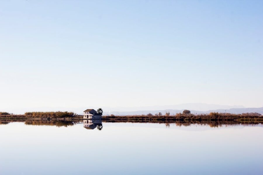 Albufera house reflection on calm water