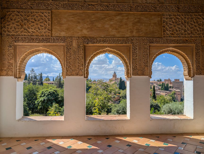 Alhambra arched window over Granada Albaicin view