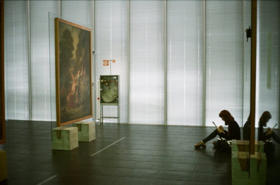 Visitor sketching at a contemporary art exhibit