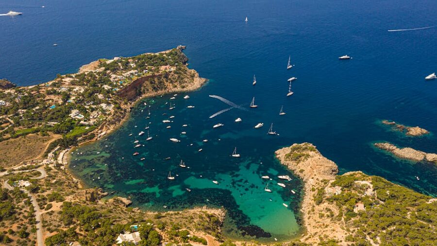 Aerial view Ibiza coastline turquoise water