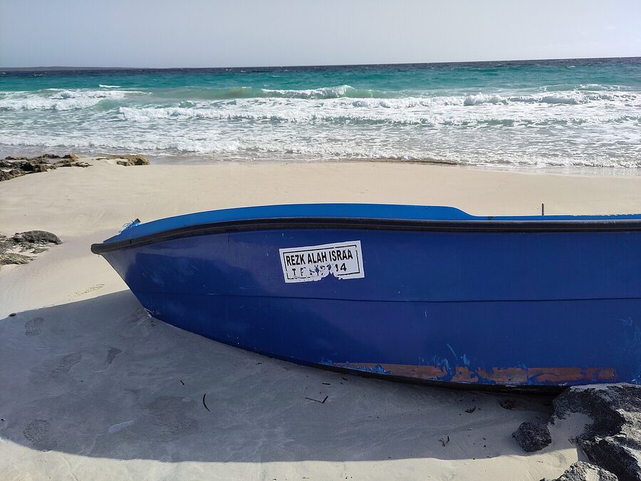 Formentera Els Trucadors beach with traditional boat