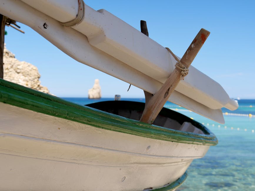 Traditional Mediterranean boat in turquoise Ibiza water
