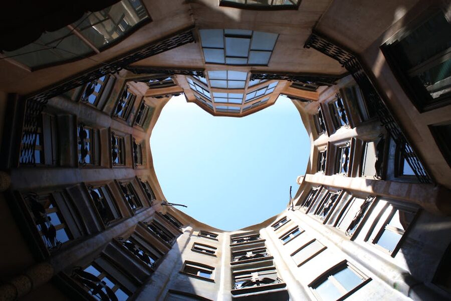 Casa Milà courtyard looking up at the curving walls