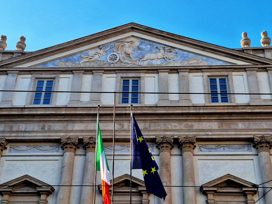 La Scala facade with Italian and EU flags