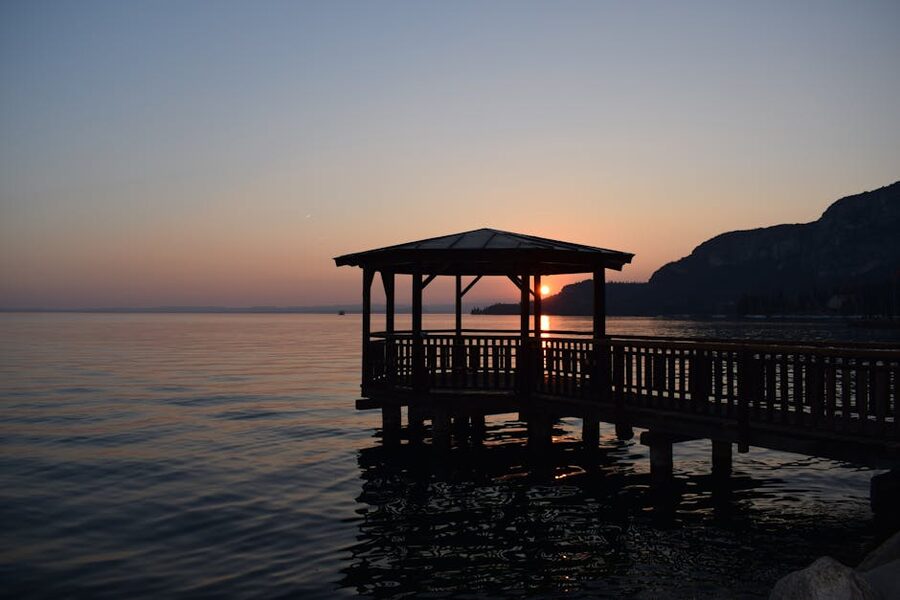 Lake Garda sunset with pier silhouette
