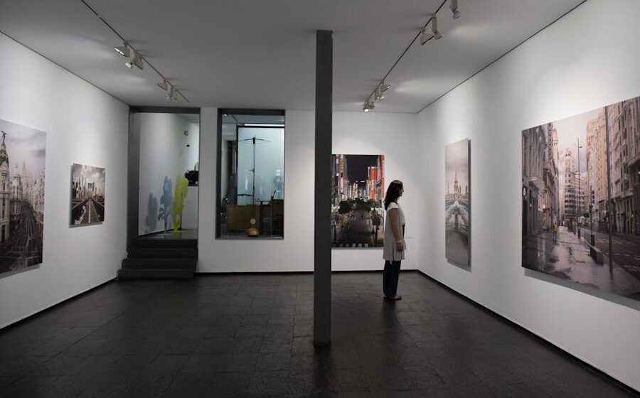 Visitor viewing paintings in a Madrid art gallery, Thyssen-Bornemisza Museum experience
