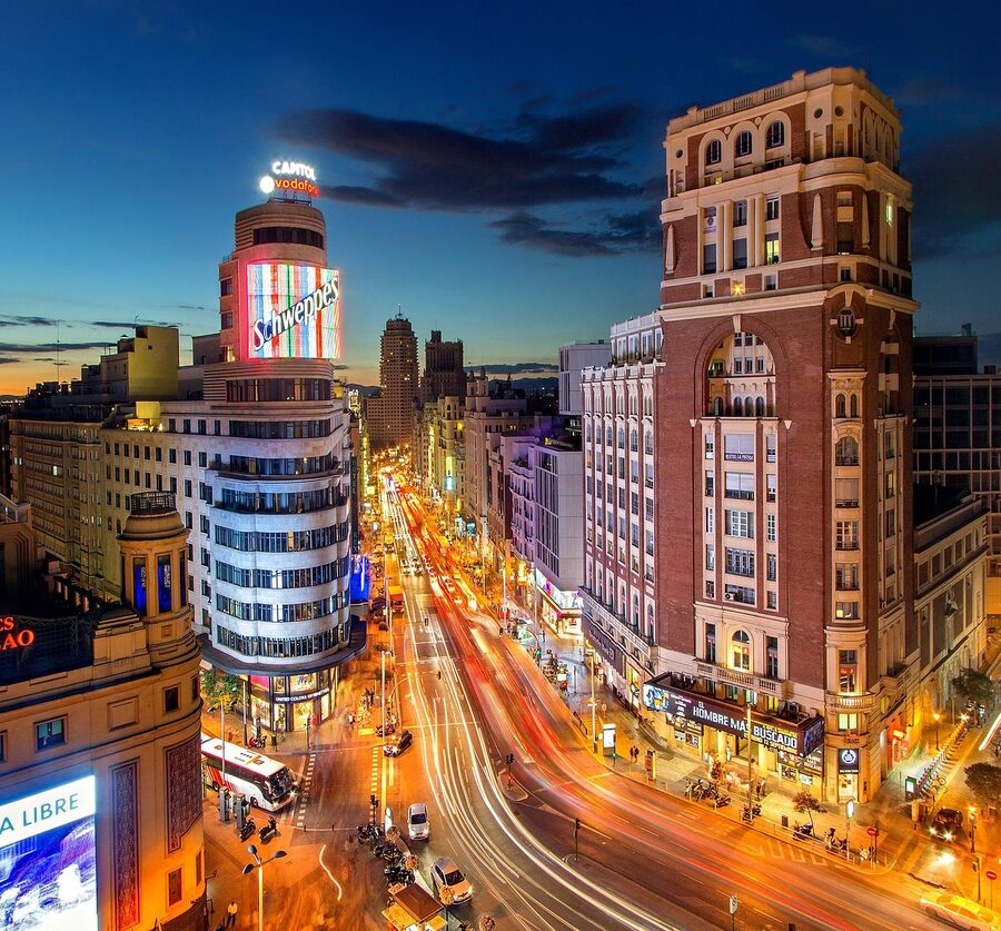 Plaza del Callao Madrid at dusk with Gran Via traffic