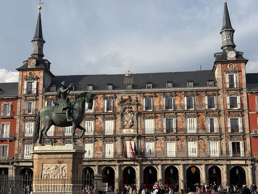 Equestrian statue of Felipe III in Plaza Mayor Madrid under blue sky