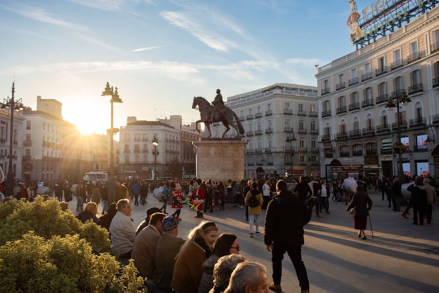 Tourists at Puerta del Sol Madrid during sunset