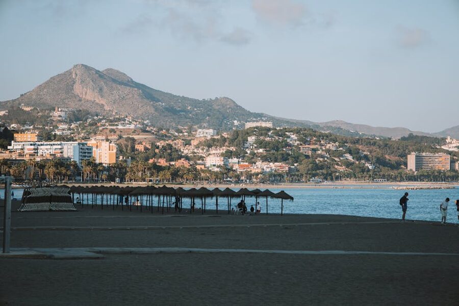 Málaga beach with mountain backdrop and people
