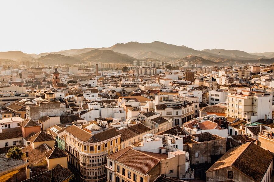 Málaga cityscape with mountains at sunset