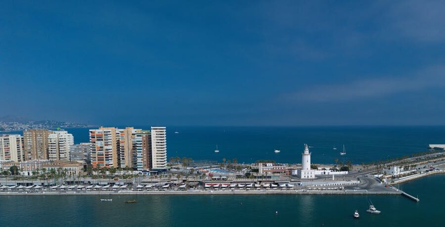 Aerial view of Málaga harbor and La Farola lighthouse
