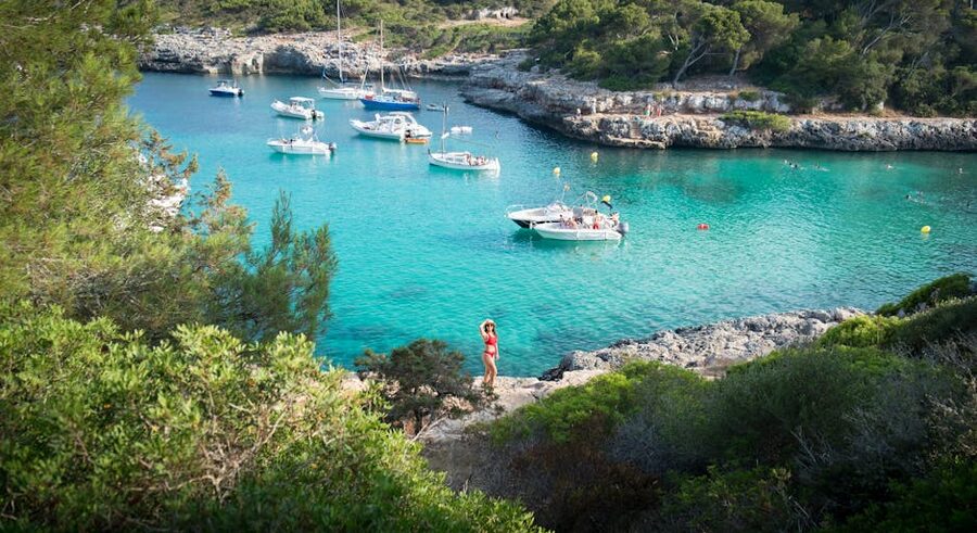 Picturesque bay in Mallorca with turquoise water and small boats