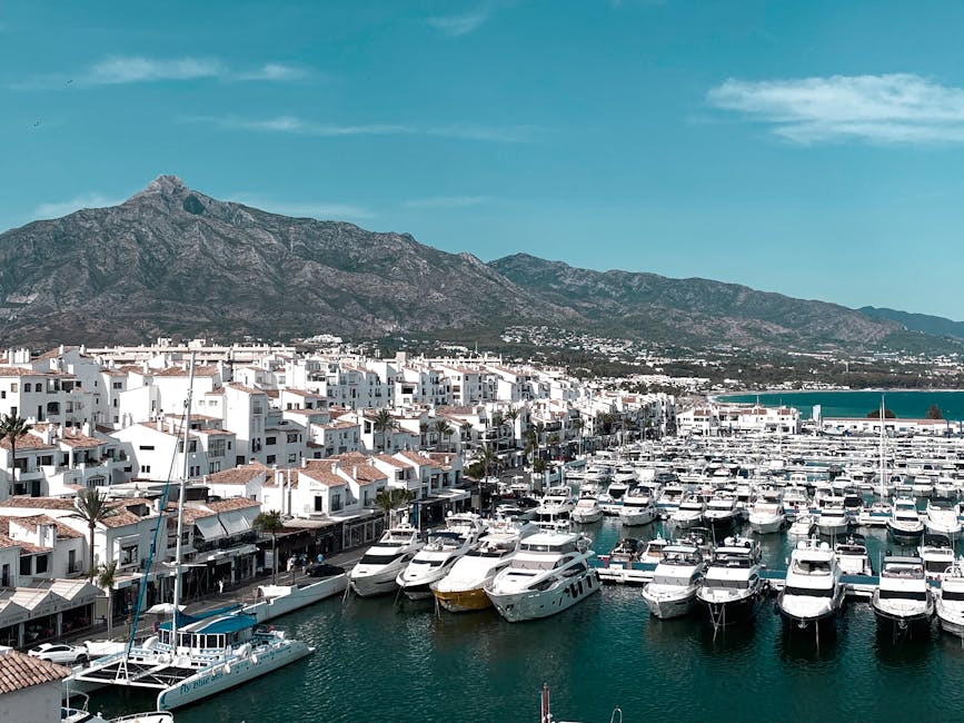Marbella marina with yachts and mountain backdrop