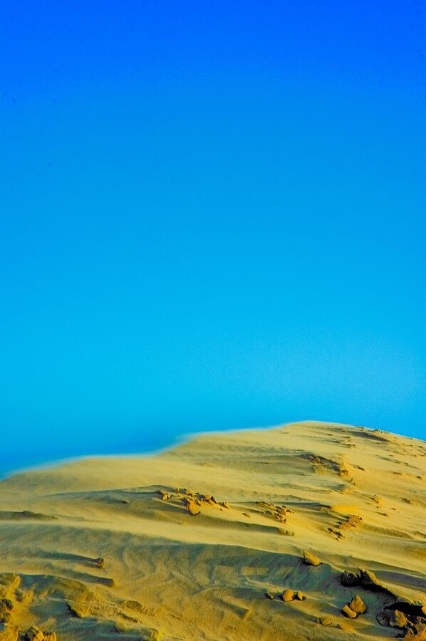 Maspalomas dunes at dusk with fading light over the sand ridges