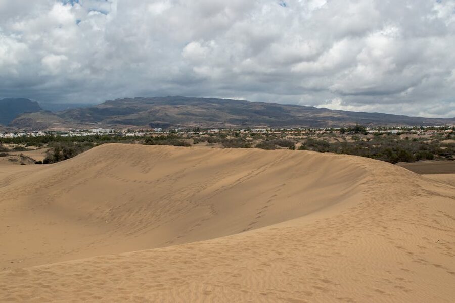 Maspalomas sand dunes with the mountainous interior of Gran Canaria behind