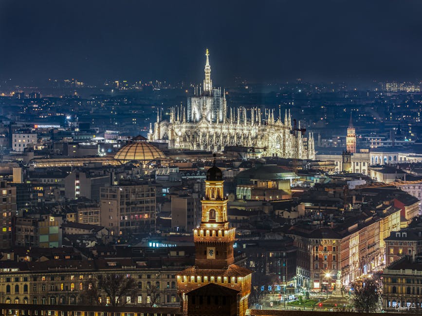 Aerial view of Milan Duomo and city skyline at night
