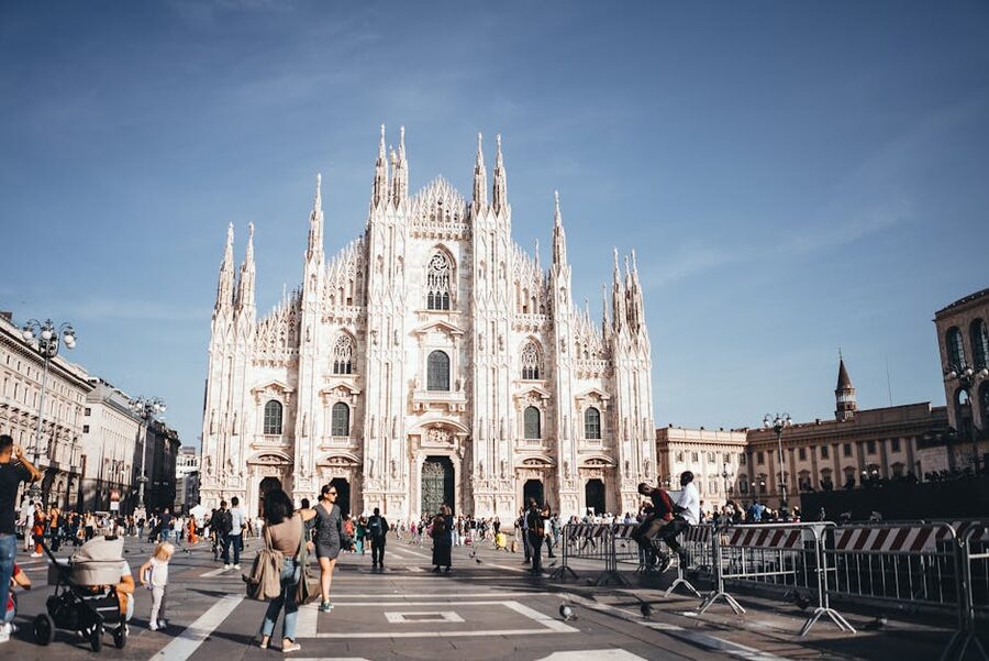 People walking in Piazza del Duomo Milan in front of the cathedral