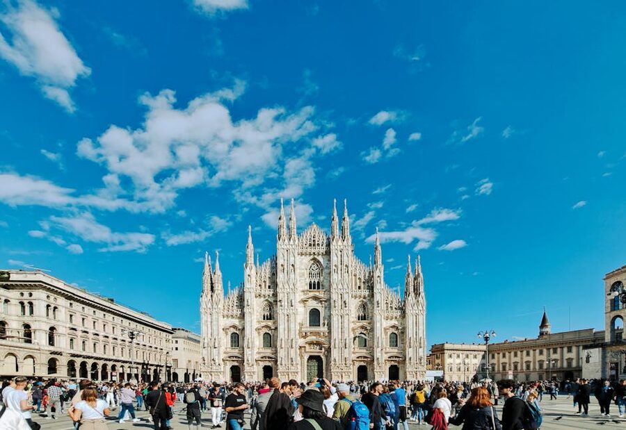 Panoramic view of Milan Duomo piazza with crowd